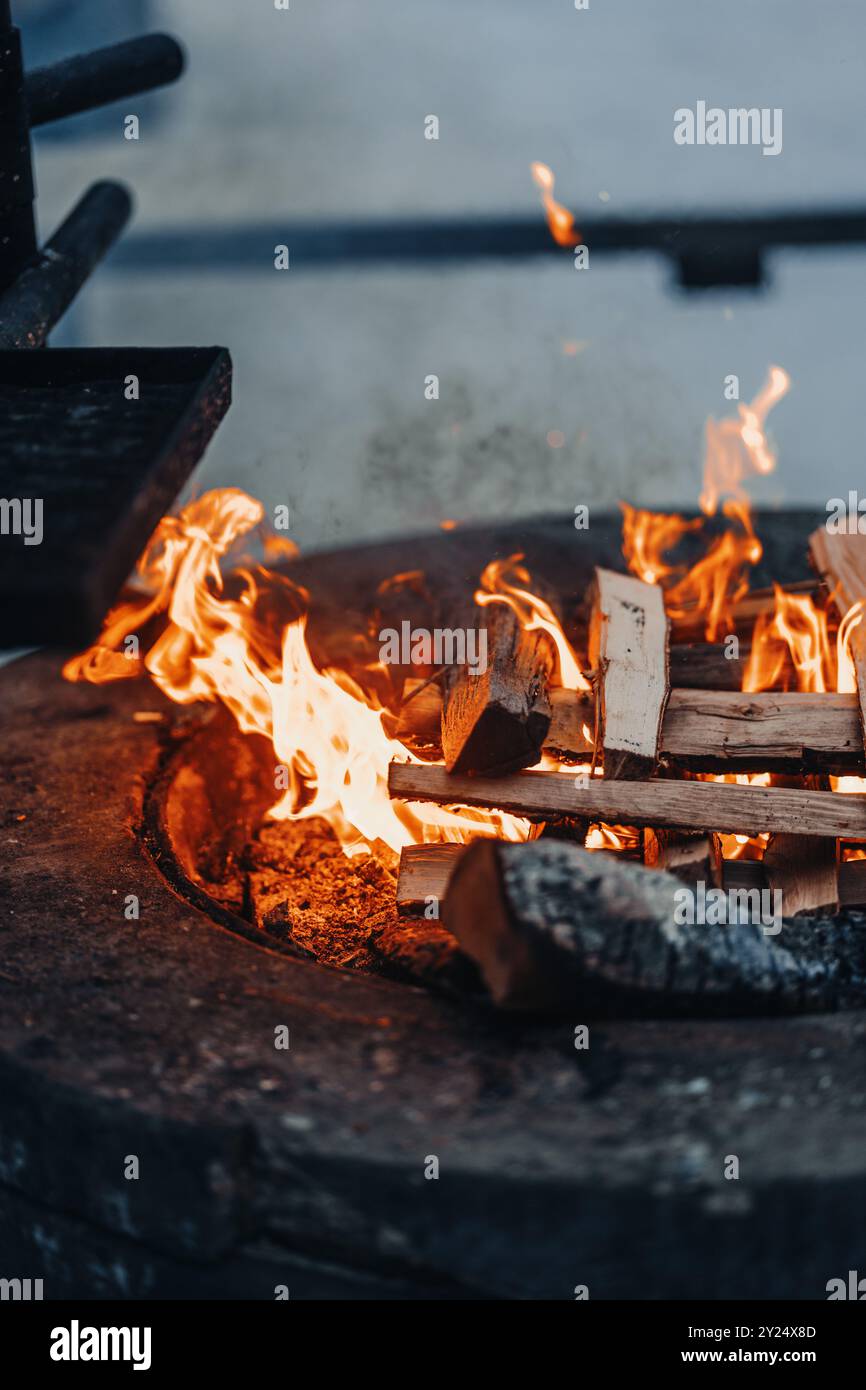 Wood burning on fire above snow in Vikakongas in Rovaniemi, Lapland ...