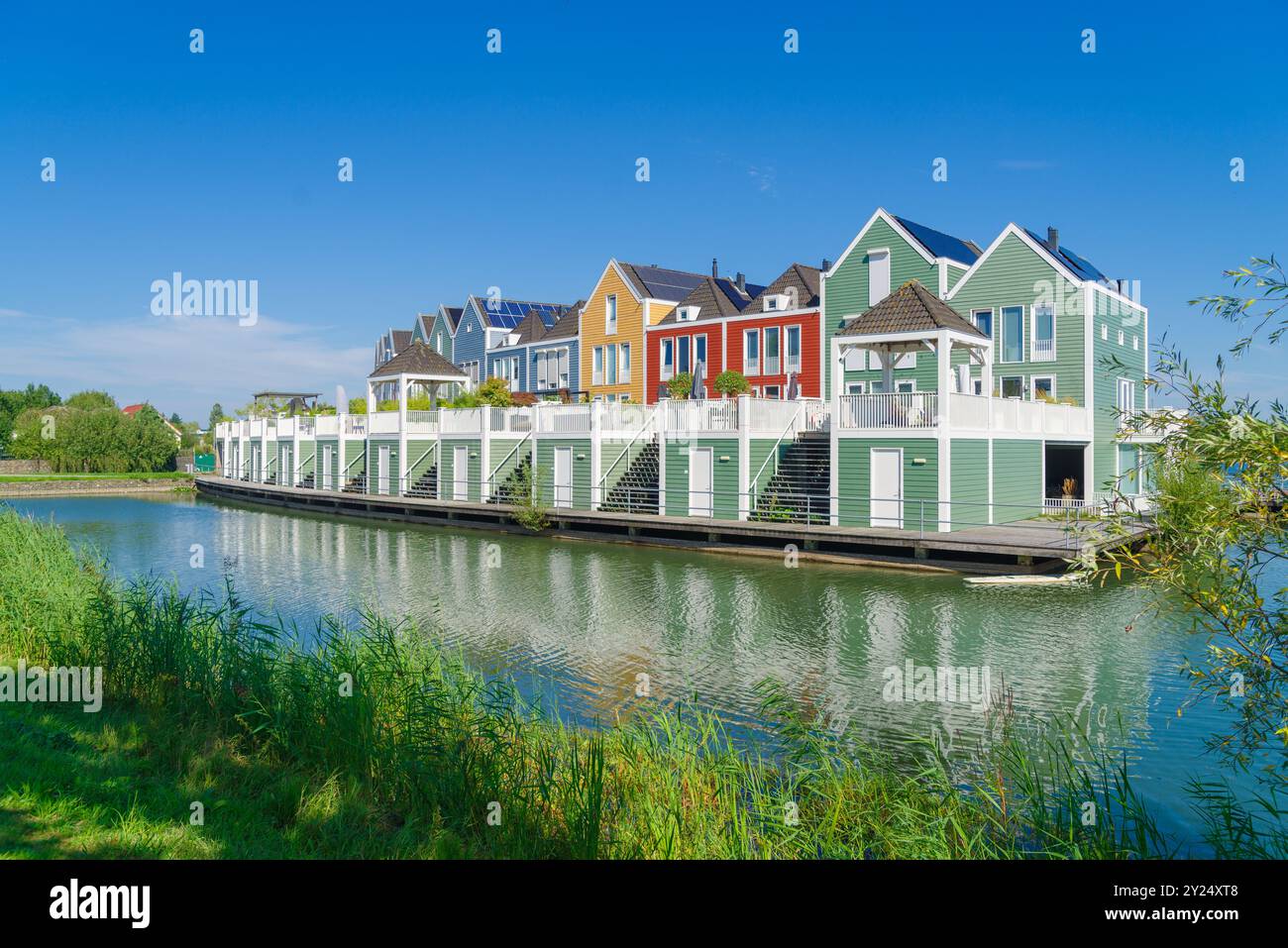 Colorful rainbow houses at a lakeside in Houten, Netherlands Stock ...