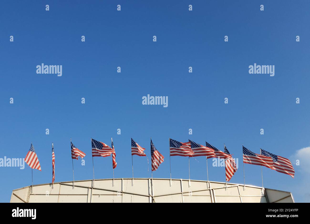 many american flags of the united states of america over blue sky Stock ...