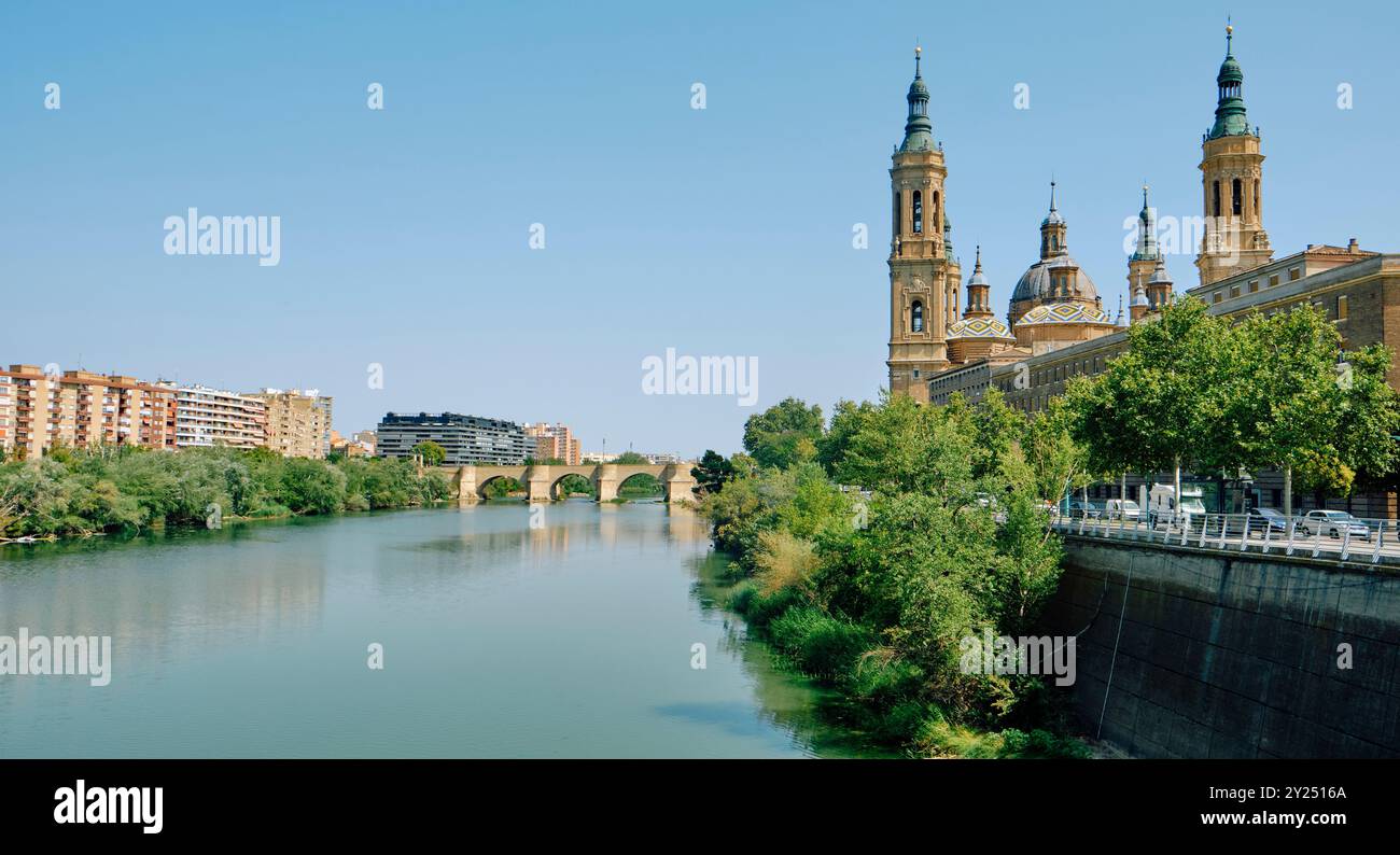 a view of the Ebro River as it passes through Zaragoza, in Spain, with ...