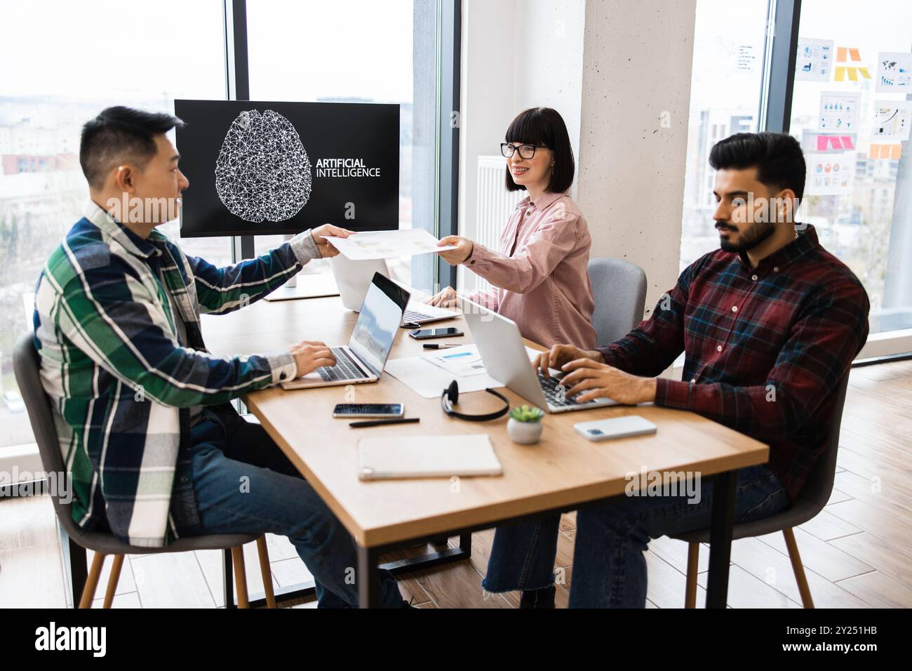 Team working on artificial intelligence project in office Stock Photo ...
