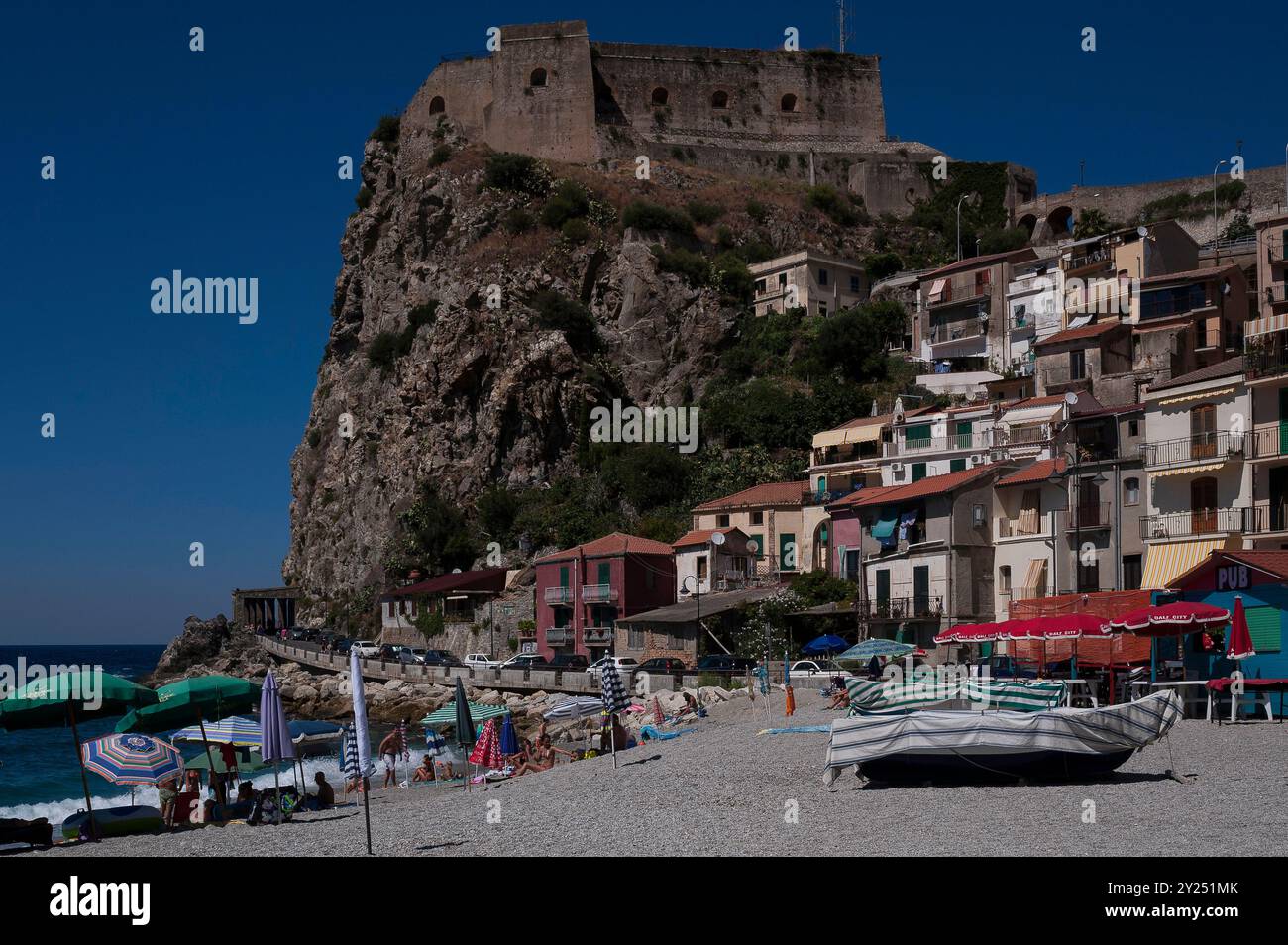 Medieval castle, the Castello Ruffo di Calabria, perched on rocks above ...
