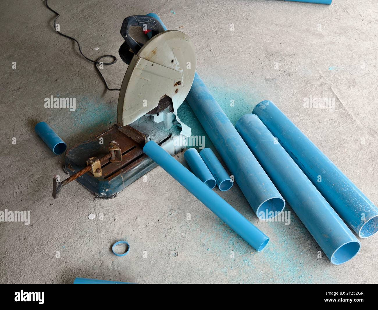 A machine for cutting pipes at construction site Stock Photo - Alamy