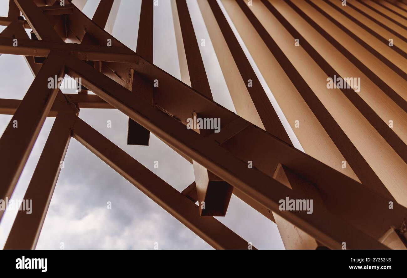 A structure featuring wooden slats on construction site contributing to ...