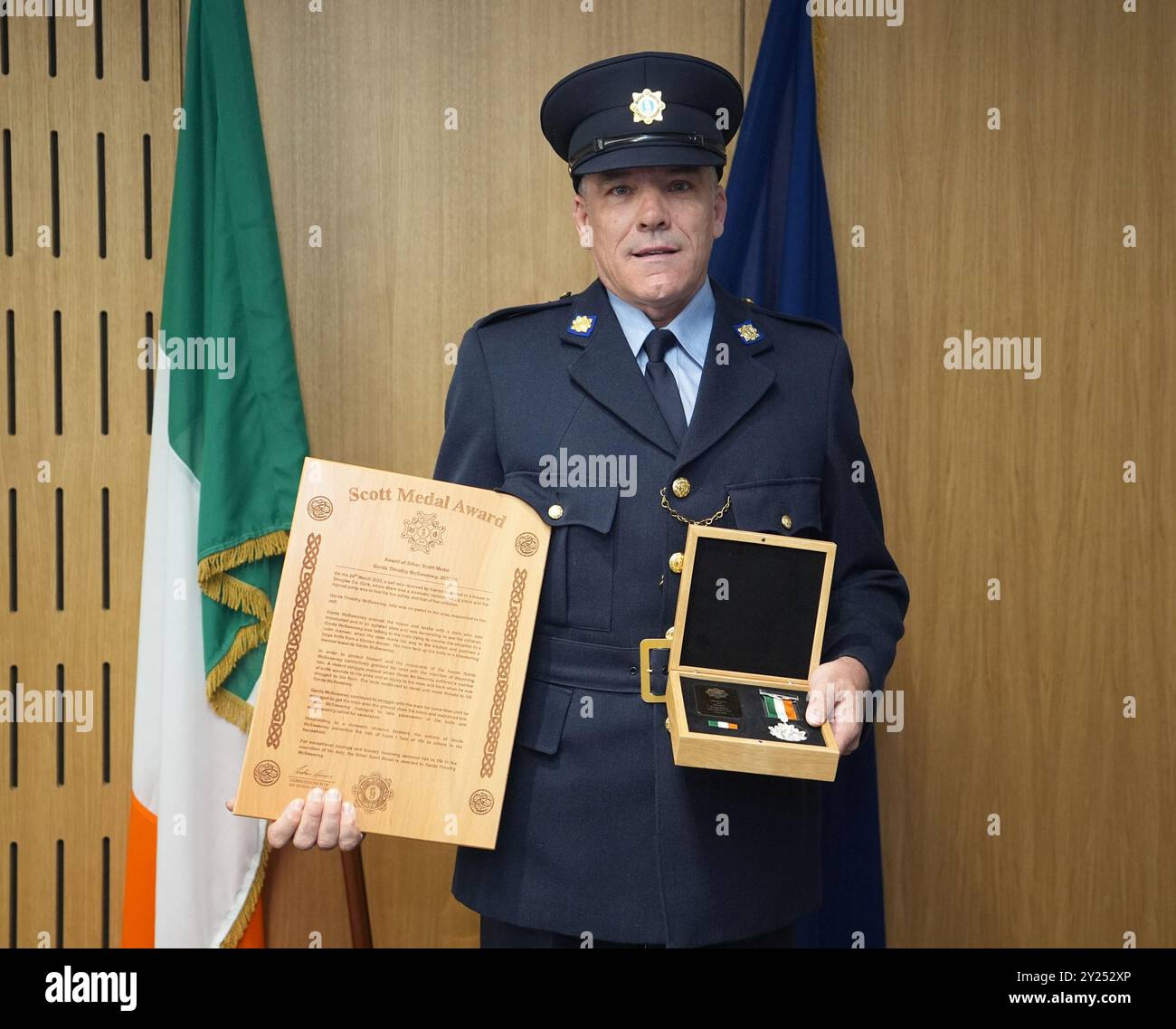 Garda Timothy McSweeney with his Silver Scott medal, during a ceremony ...