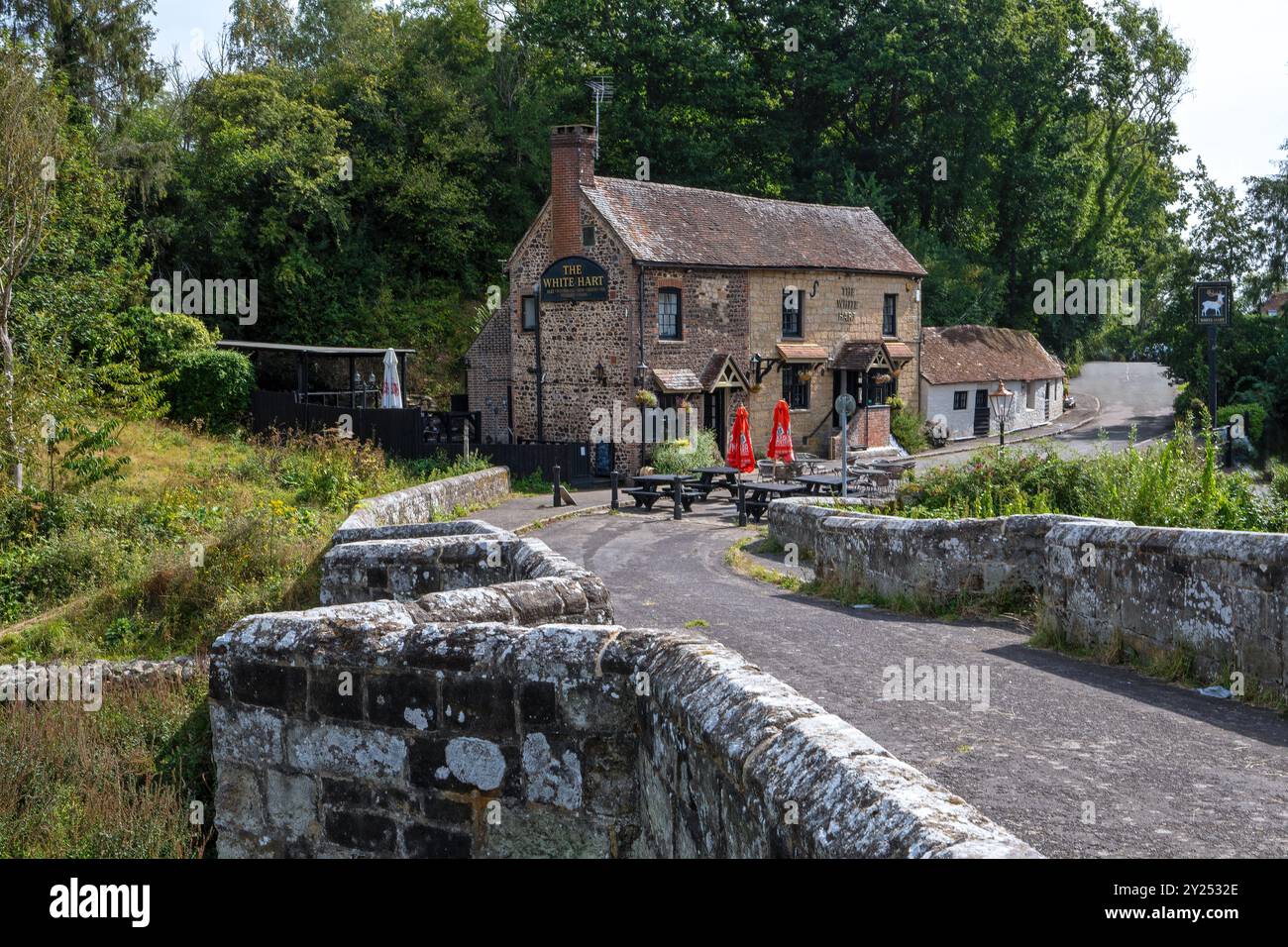 The historical Stopham Bridge and the White Hart Pub situated on the ...