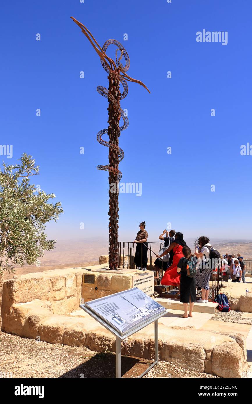 Mount Nebo in Jordan - May 09 2024: people visit the Serpentine Cross ...