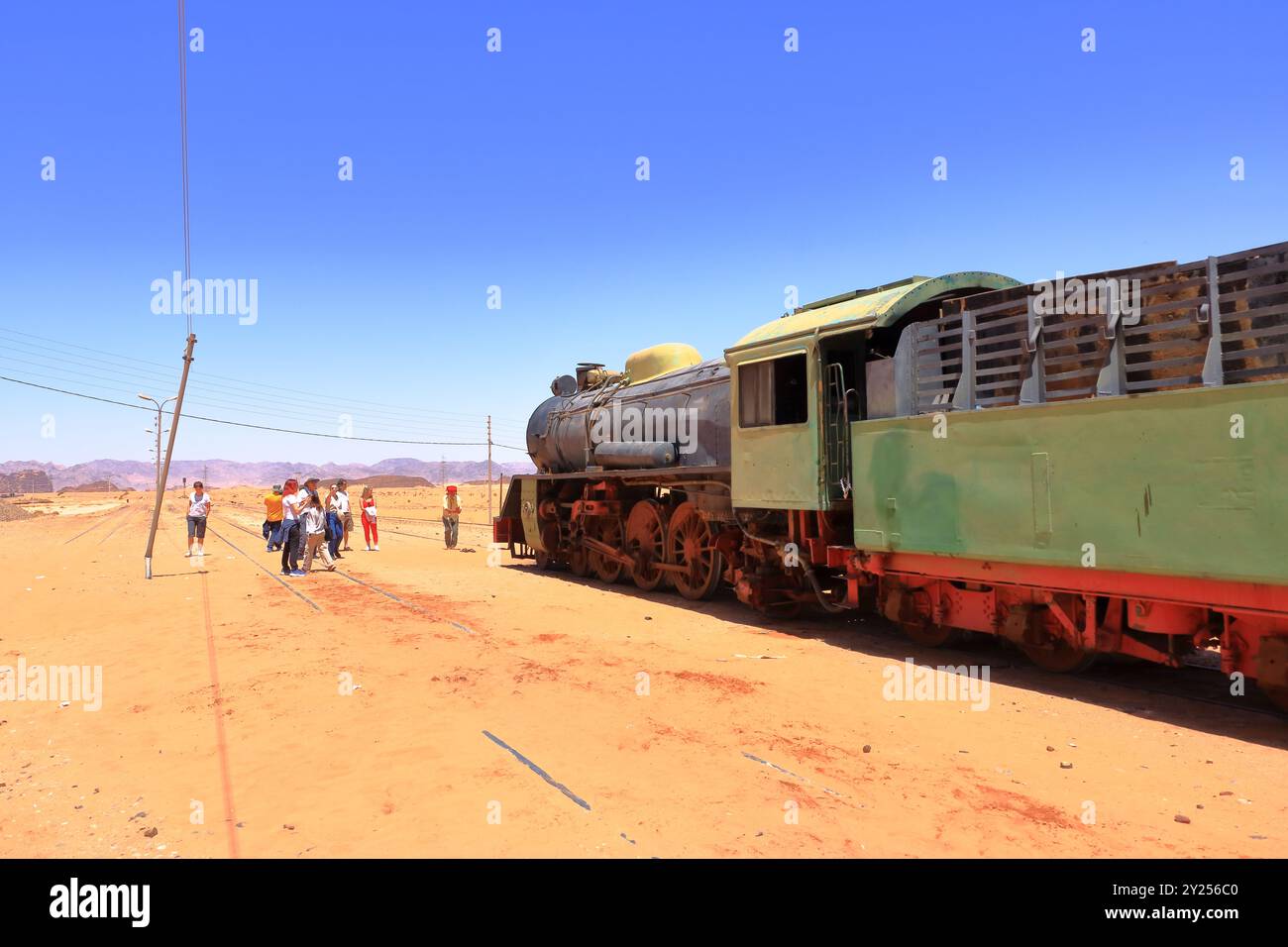 Wadi Rum in Jordan - May 15 2024: people visit the old Locomotive train ...