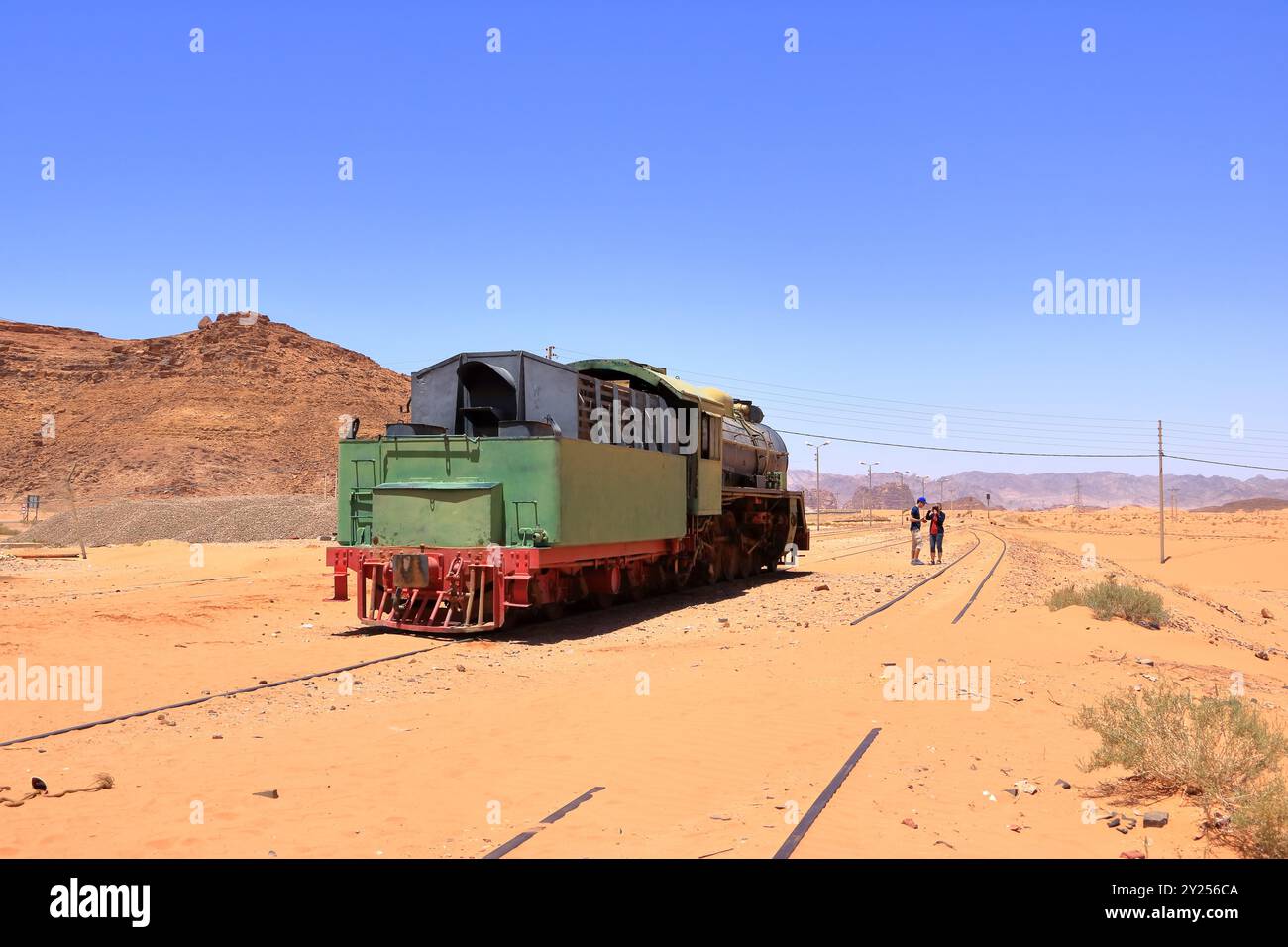 Wadi Rum in Jordan - May 15 2024: people visit the old Locomotive train ...