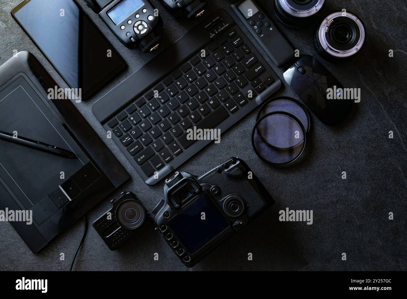 Digital photo workstation over black background.Top view of digital ...
