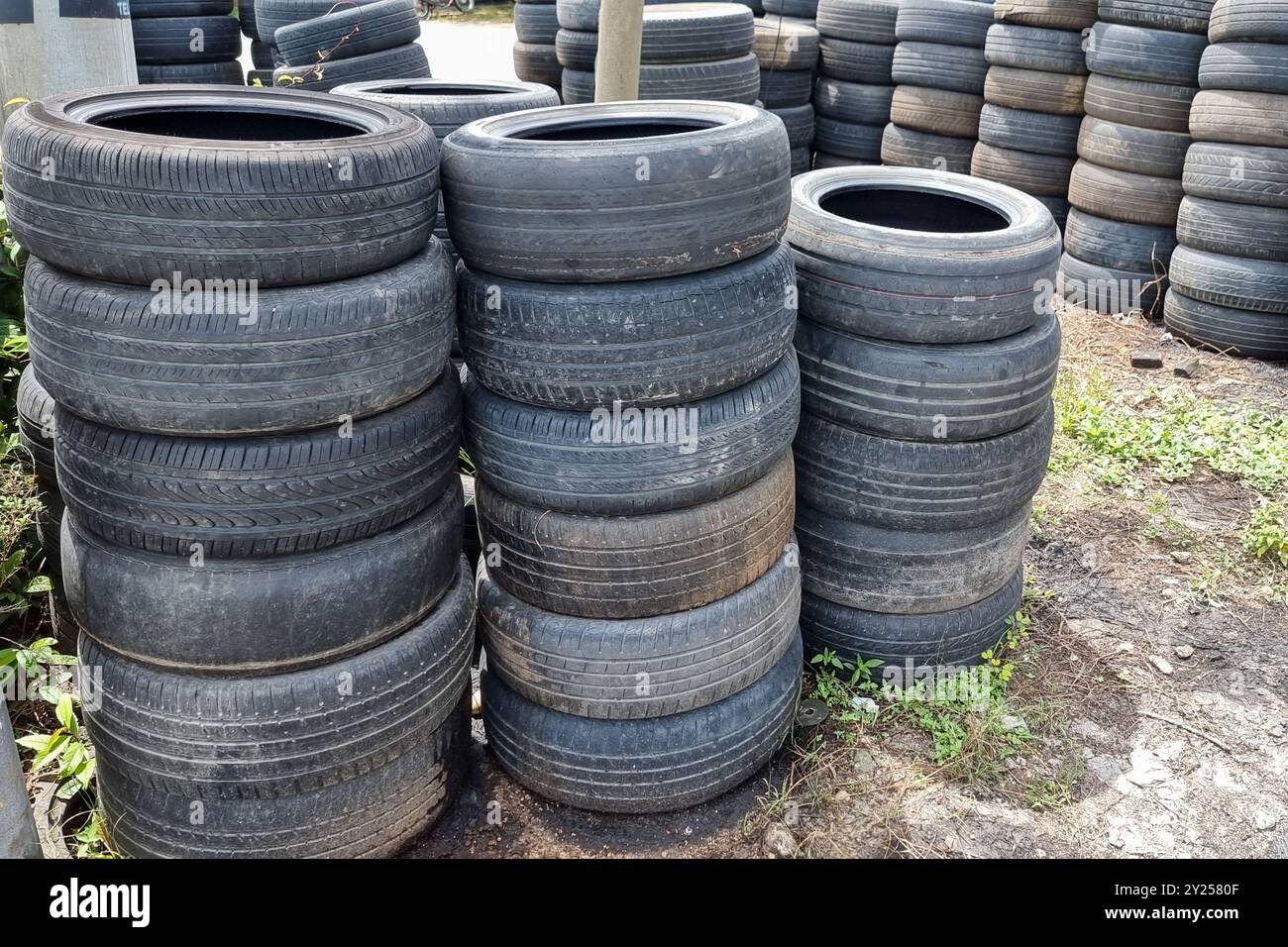 Piles of old and used tires risk collecting rain water and become ...