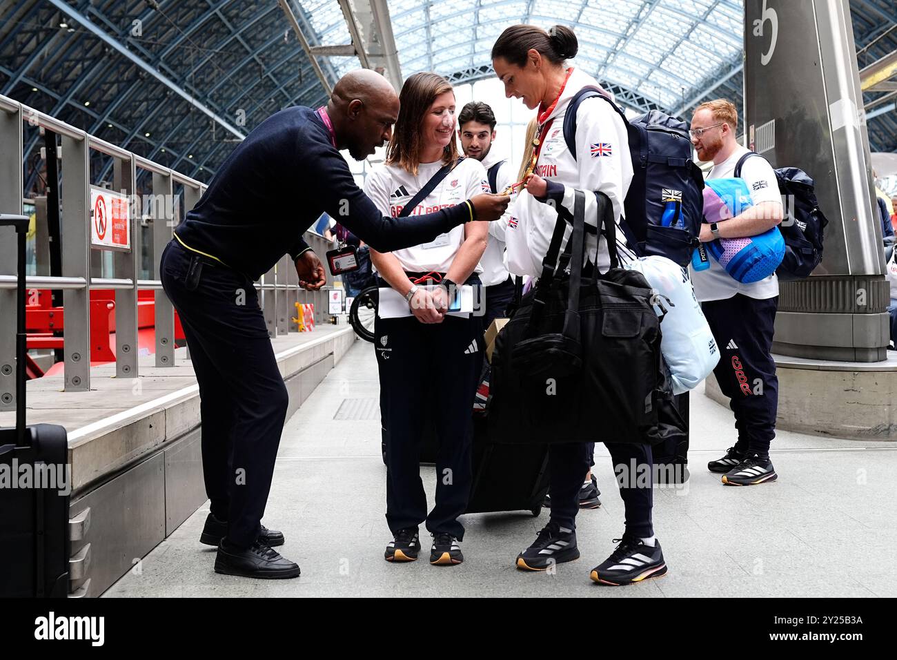 A member of staff takes a closer look at Great Britain's Sarah Storey's ...