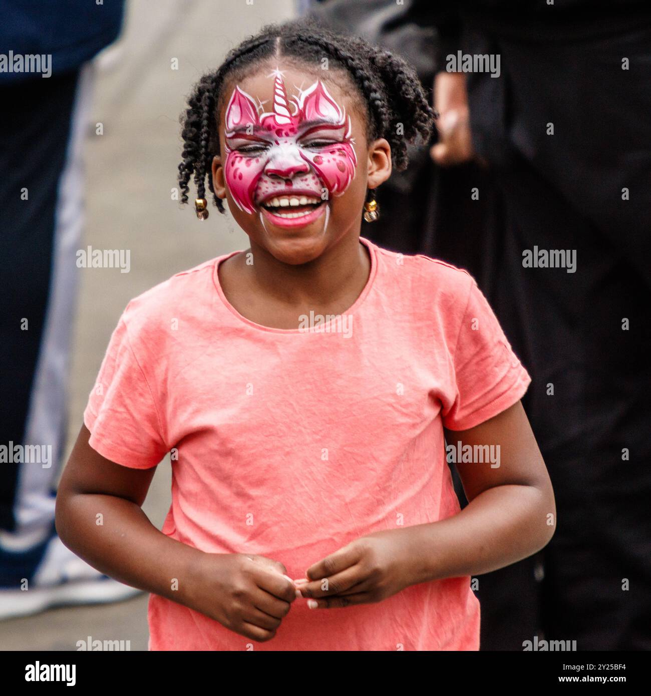 A child laughing and having fun at the "Black On The Square" event in ...