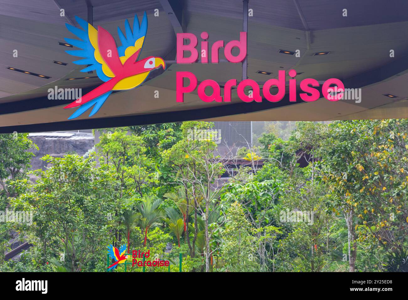 Red signage of Bird Paradise and bird logo. The Largest Bird Park in ...