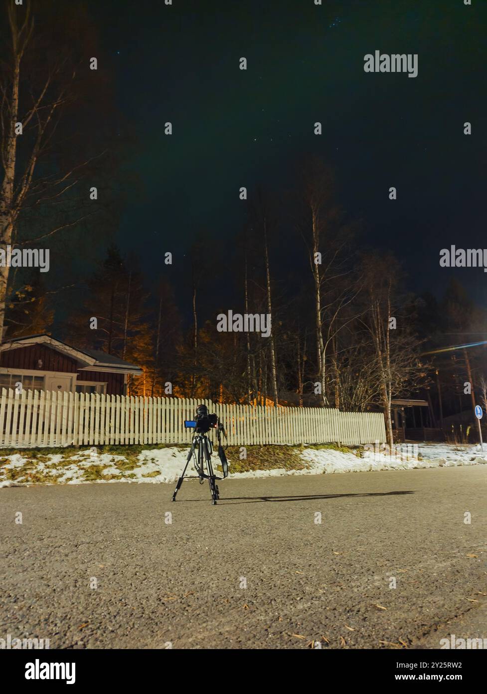 Faint northern lights over house and camera in Rovaniemi, Lapland in ...