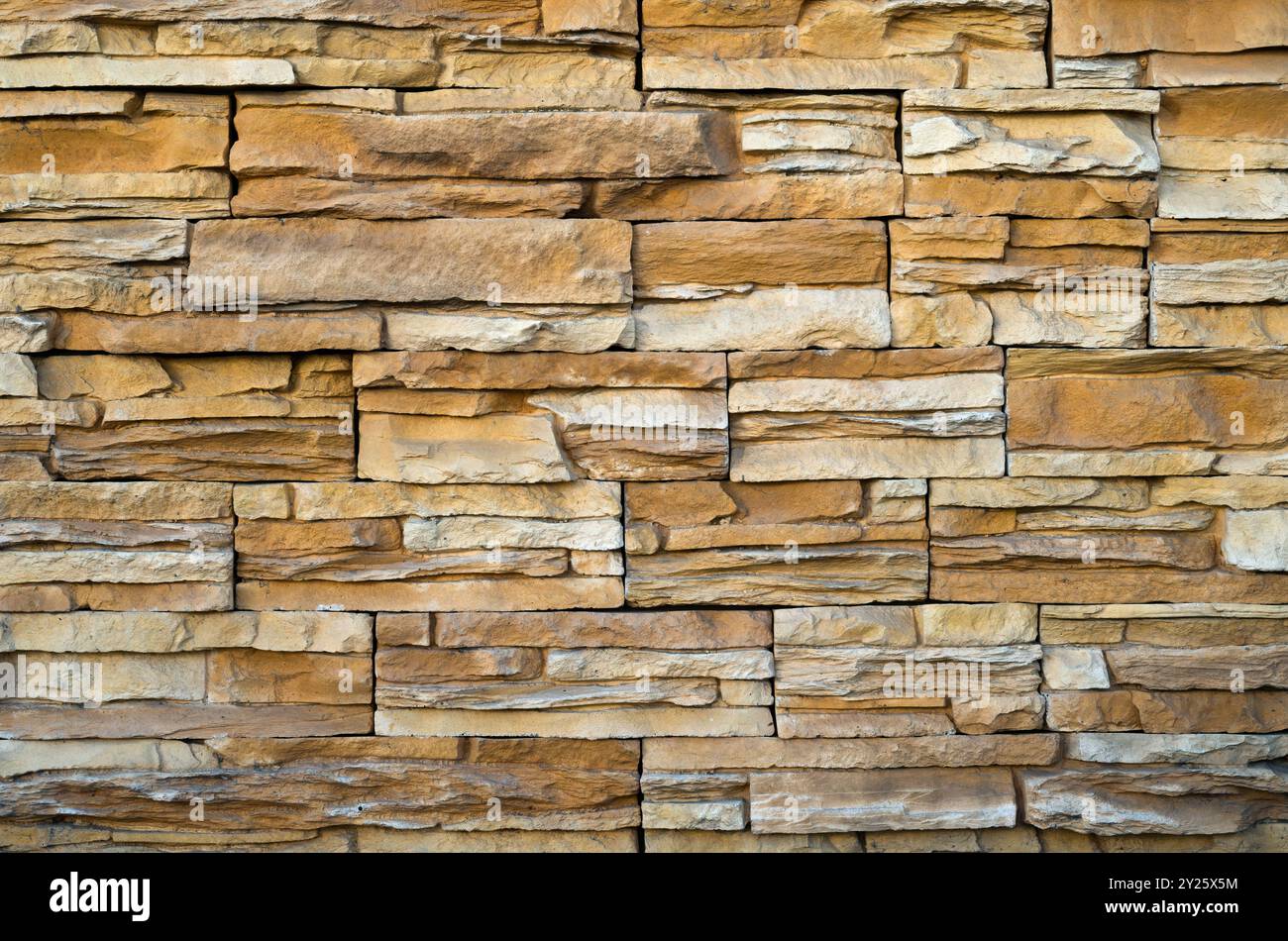 Stone cladding made of horizontal strips. External modern front wall ...