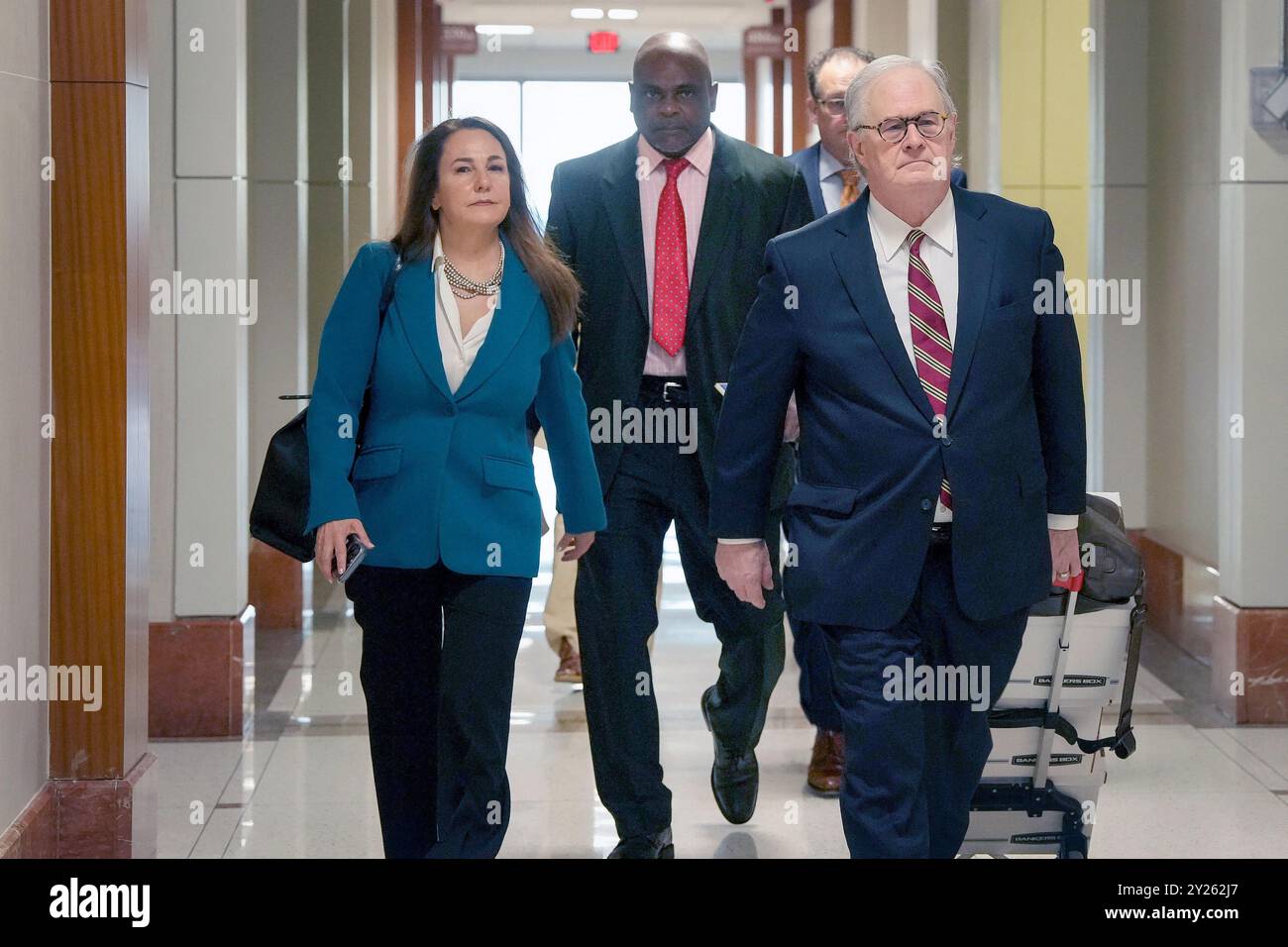 Retired Houston Police Department officer Gerald Goines, center, and ...