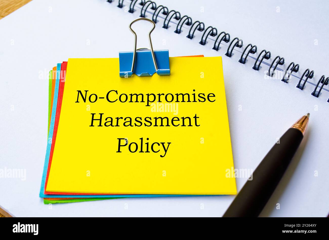 No compromise harassment policy text written on yellow sticky note ...