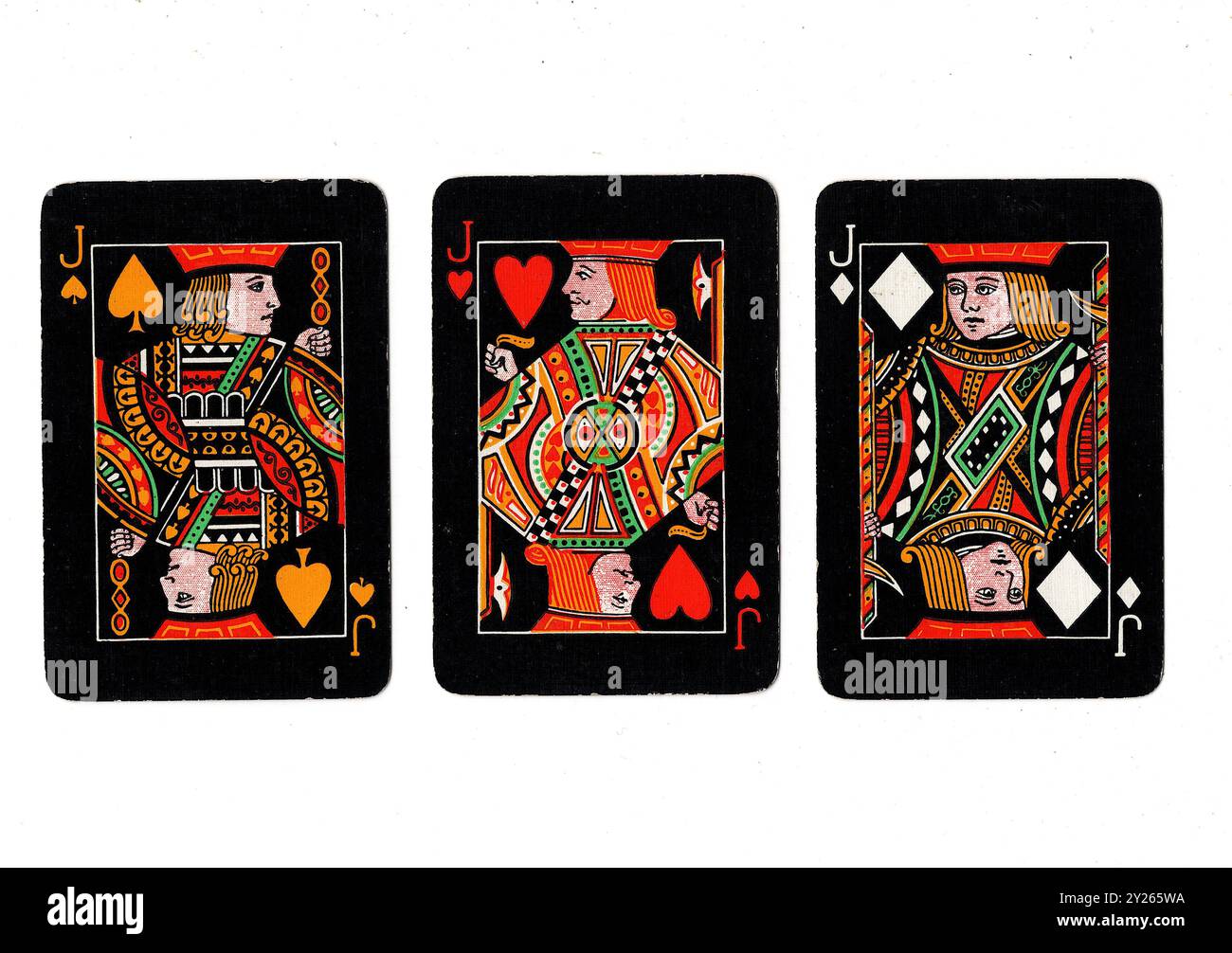 Vintage black playing cards showing three jacks on a white background ...