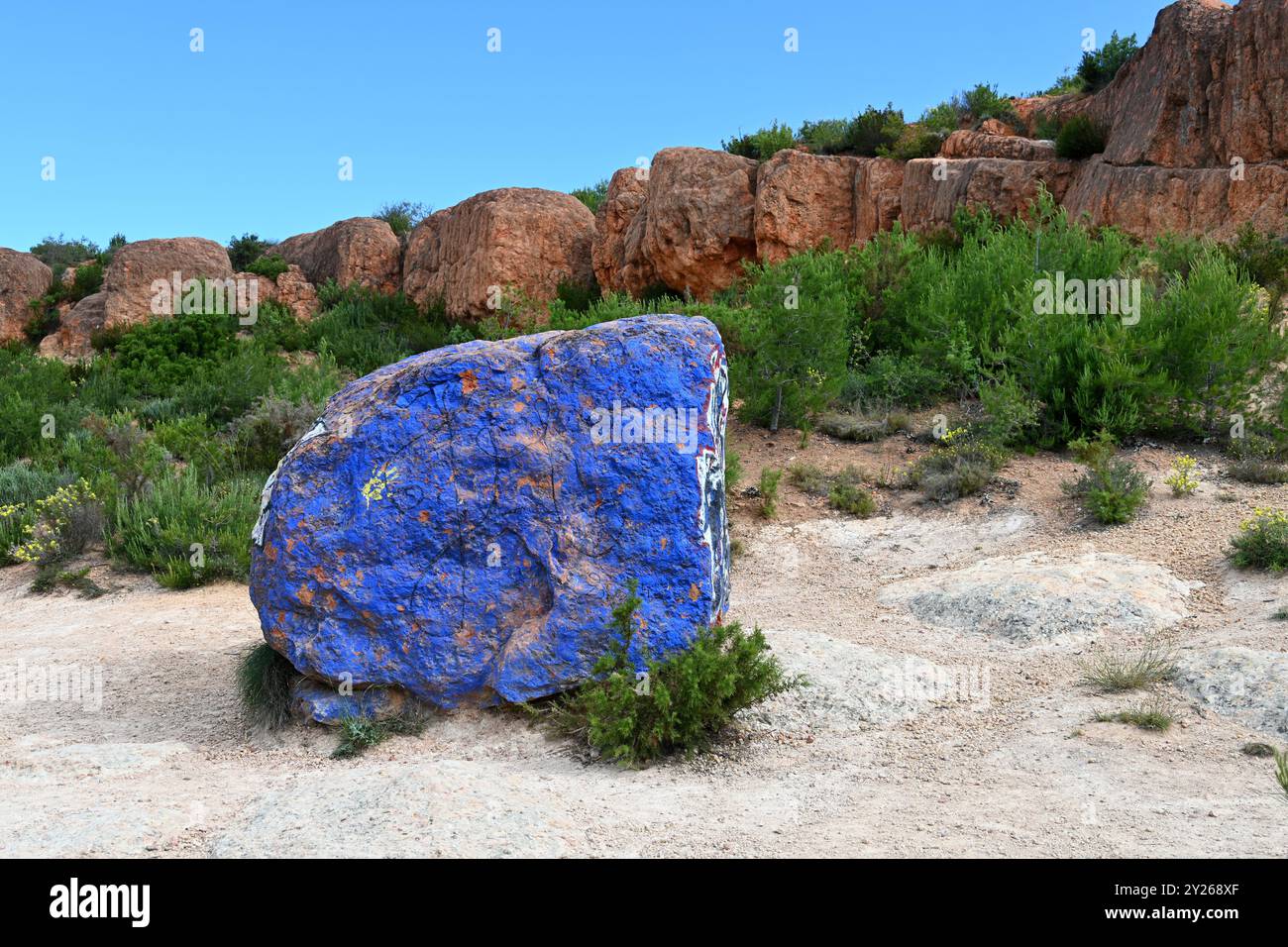 Painted Blue Rock, Boulder or Rural Graffiti Among the Red or Ochre ...