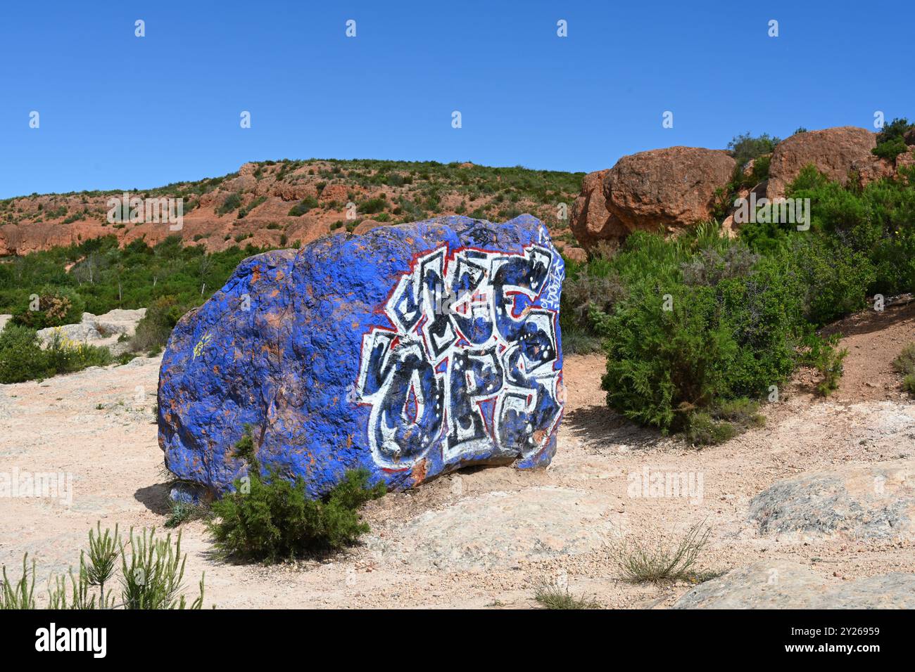 Painted Blue Rock, Boulder or Rural Graffiti Among the Red or Ochre ...
