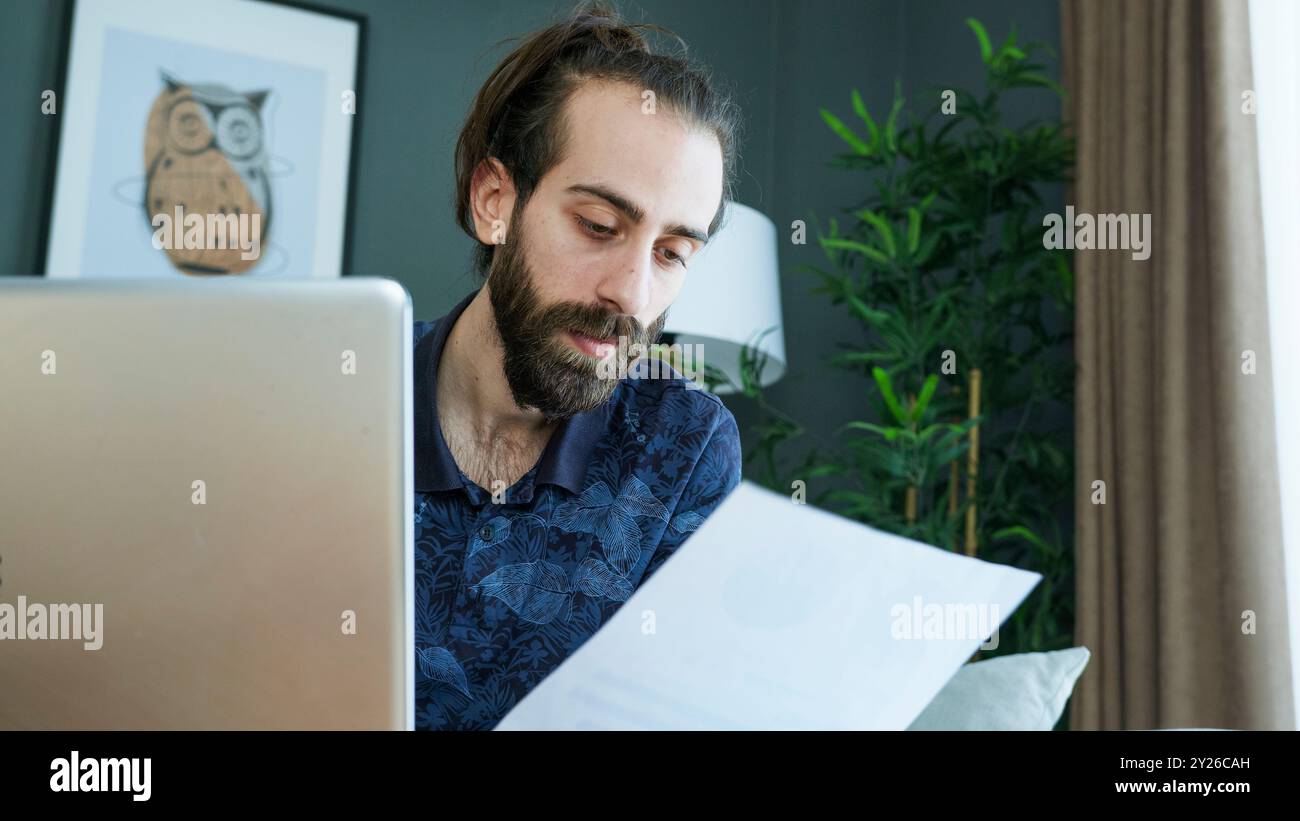 Man reviews bills hi-res stock photography and images - Alamy
