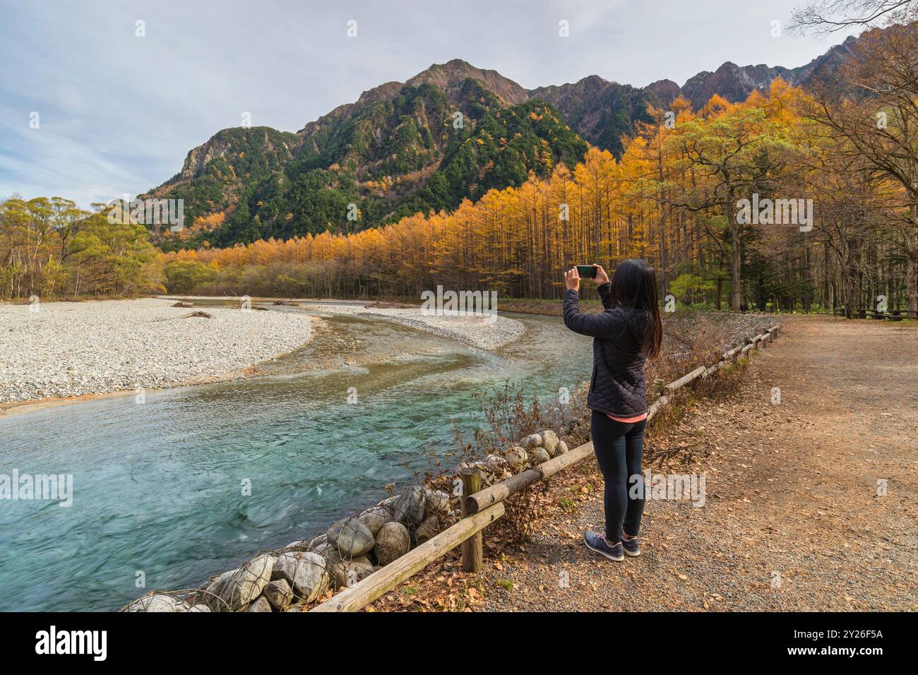Nature landscape at Kamikochi Japan in autumn season with woman tourist ...