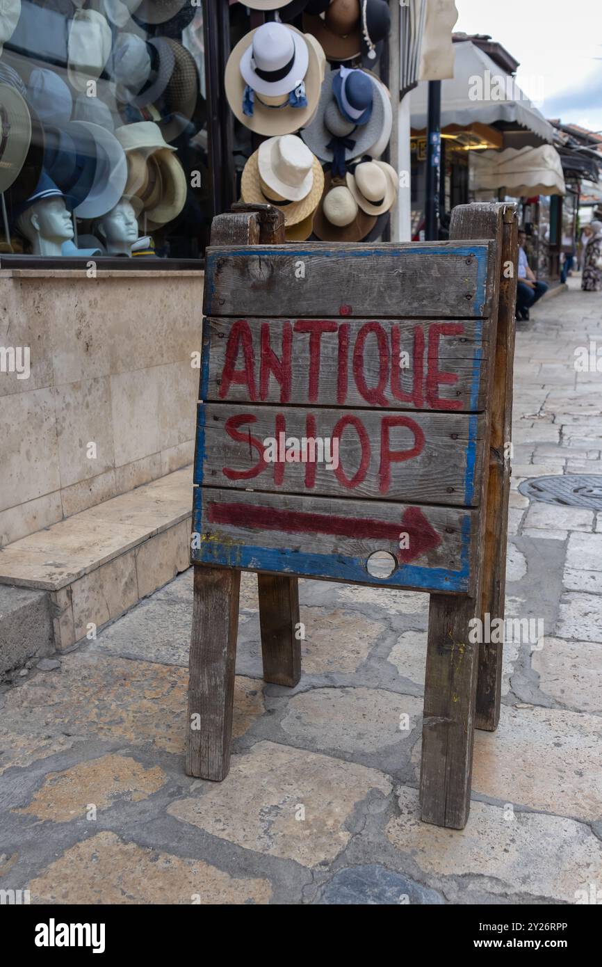 Antique Shop Sign Direction Arrow Wood Board at Street Stock Photo - Alamy