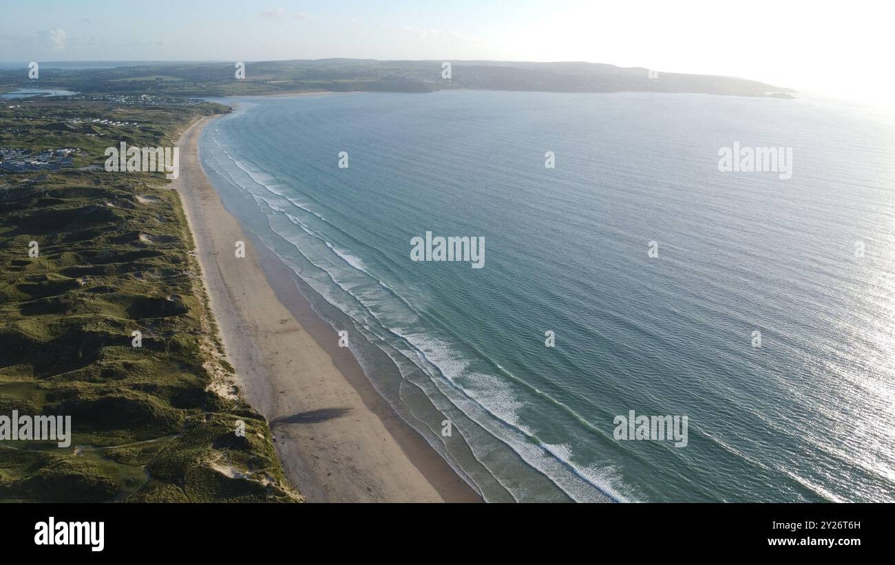 sunny sandy beach with clear sea Stock Photo - Alamy
