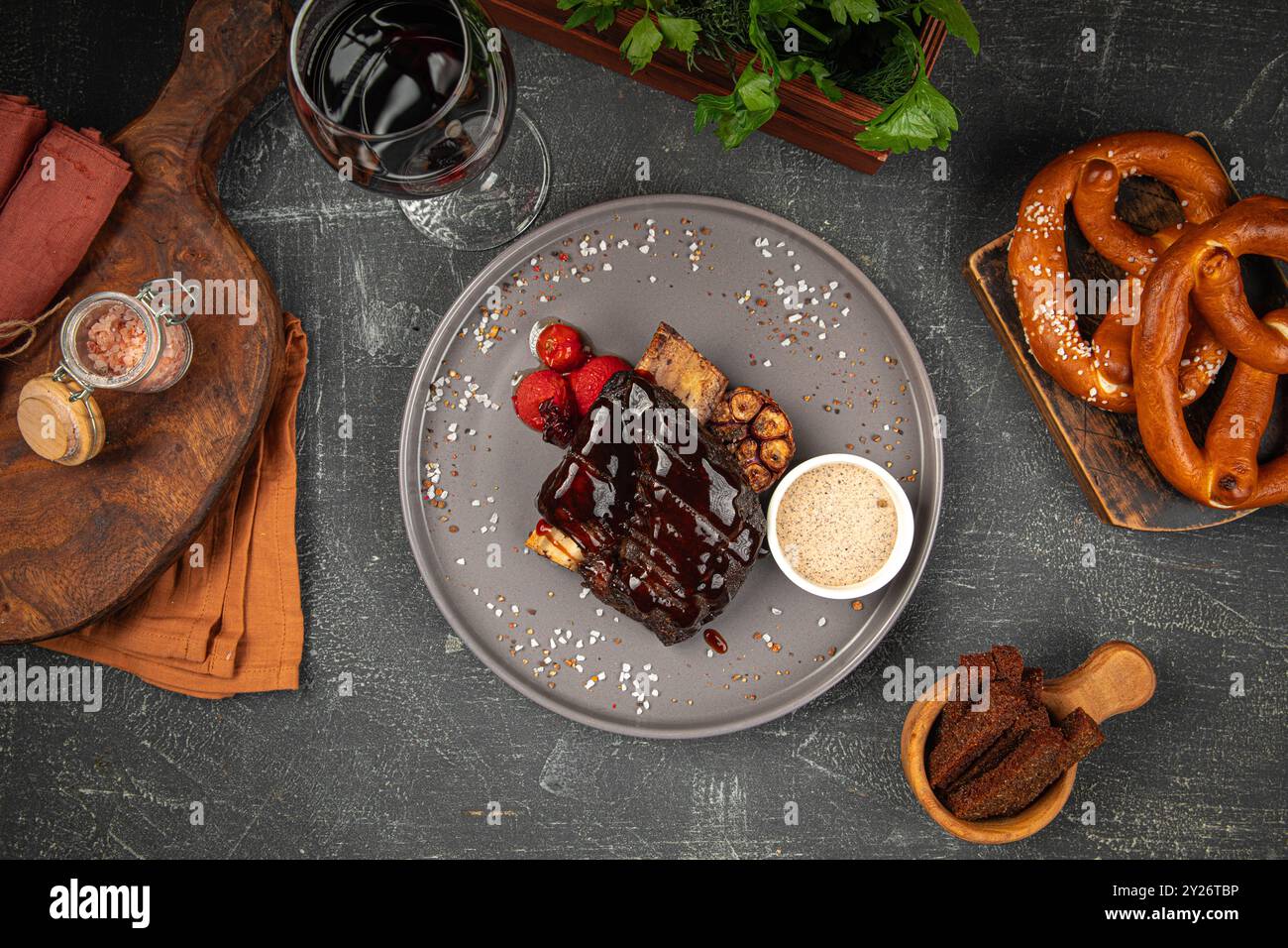 German grilled beef ribs with baked garlic Stock Photo - Alamy