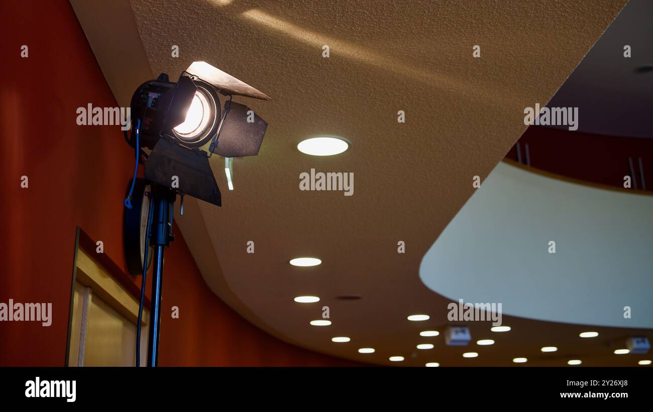 A spotlight in a bity hall Stock Photo - Alamy
