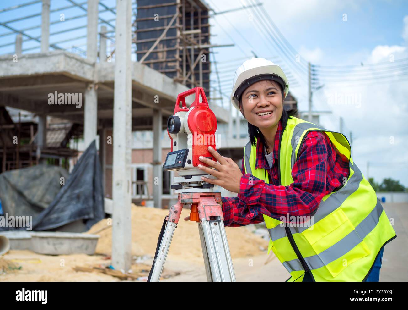 Surveyor and survey equipment on construction site, Land and soil ...