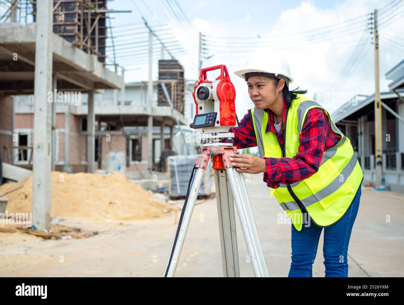Surveyor and survey equipment on construction site, Land and soil ... Surveyor and survey equipment on construction site, Land and soil ...
