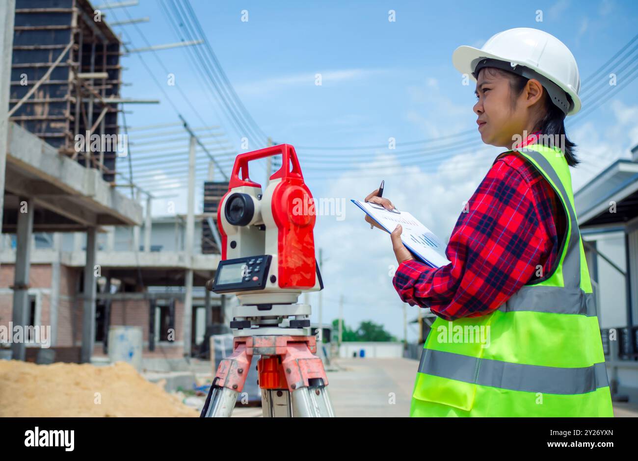 Engineers holding documents for planning and design for project at ...