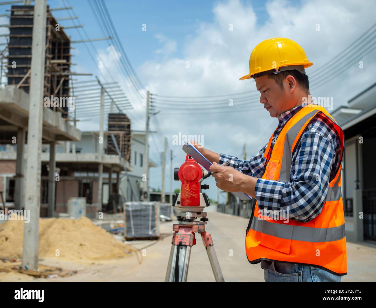 Engineers holding documents for planning and design for project at ...