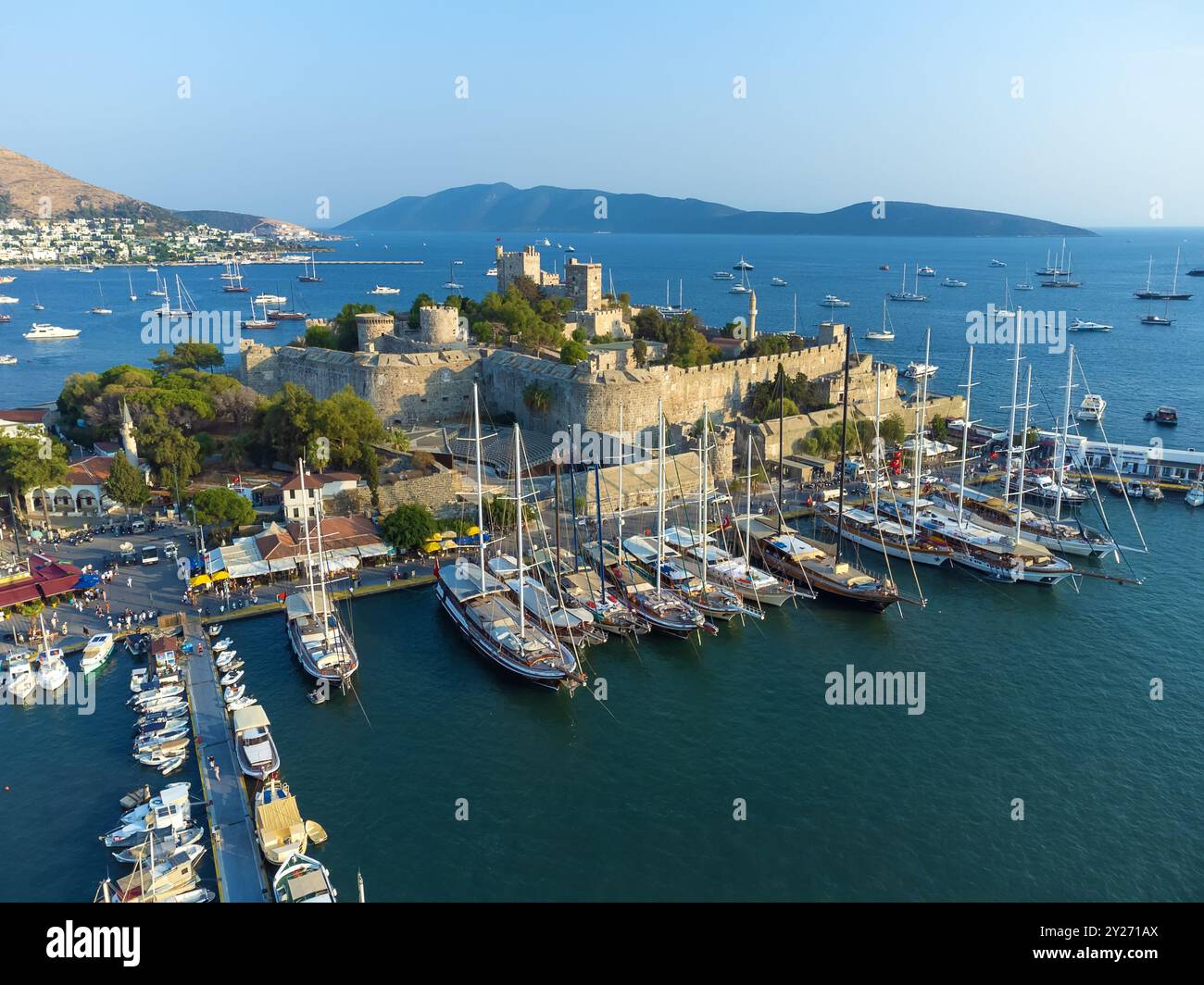 Stunning drone view of the beautiful, yacht-filled harbor of Bodrum and ...