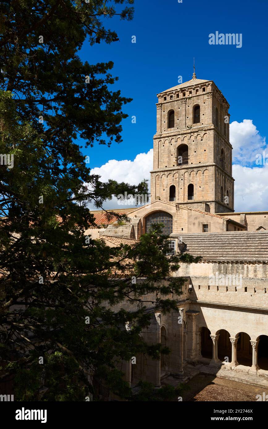 The bell tower and cloisters of the medieval church of St Trophime ...