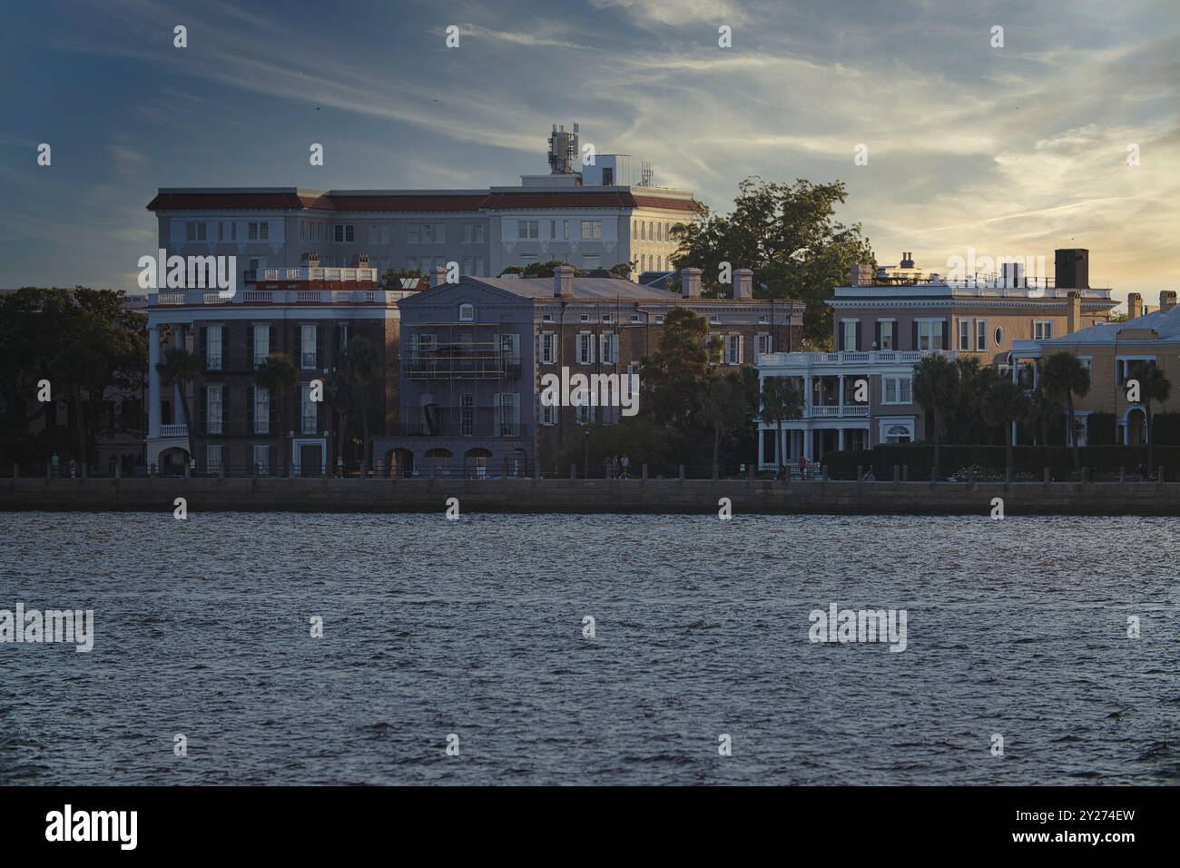 Beautiful sunset sky over Charleston Harbor and historic homes district ...