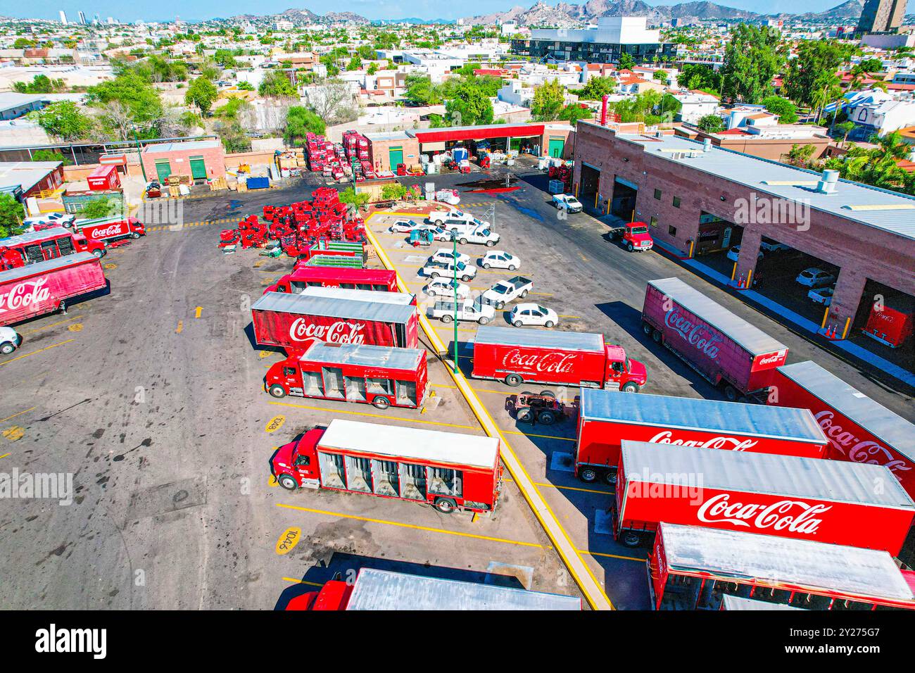 Red Coca Cola trucks or The Coca-Cola Company aerial view of the soda ...