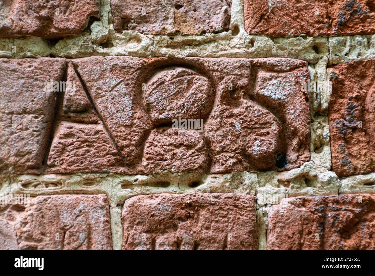 Detail of historic graffiti carved into bricks of the Camberley Obelisk ...