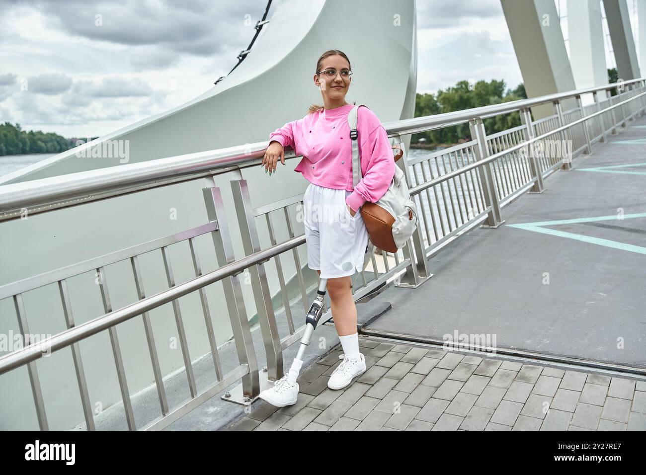 A young woman with a prosthetic leg smiles, embracing an active ...