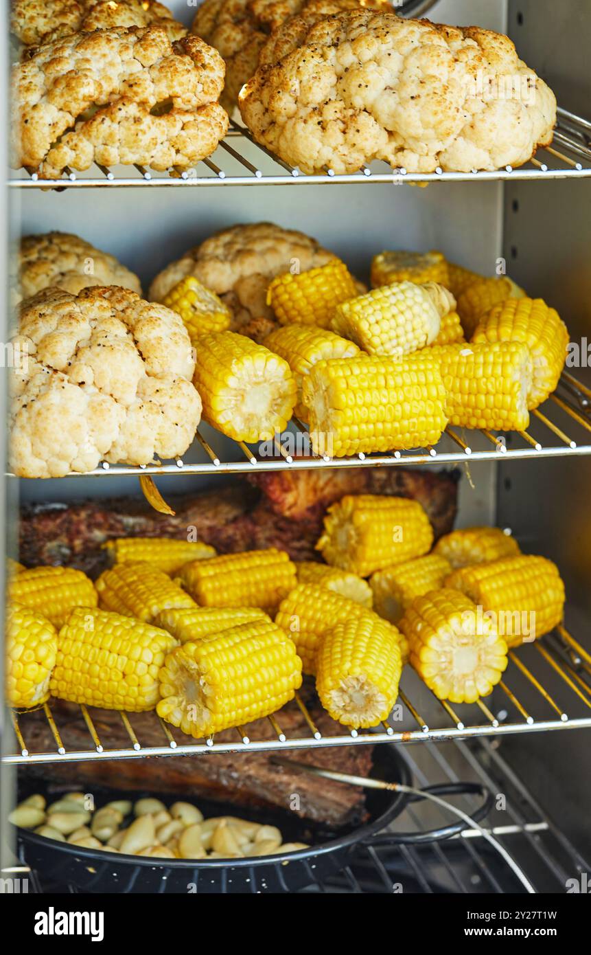 Roasted cauliflower and corn on grill rack Stock Photo - Alamy