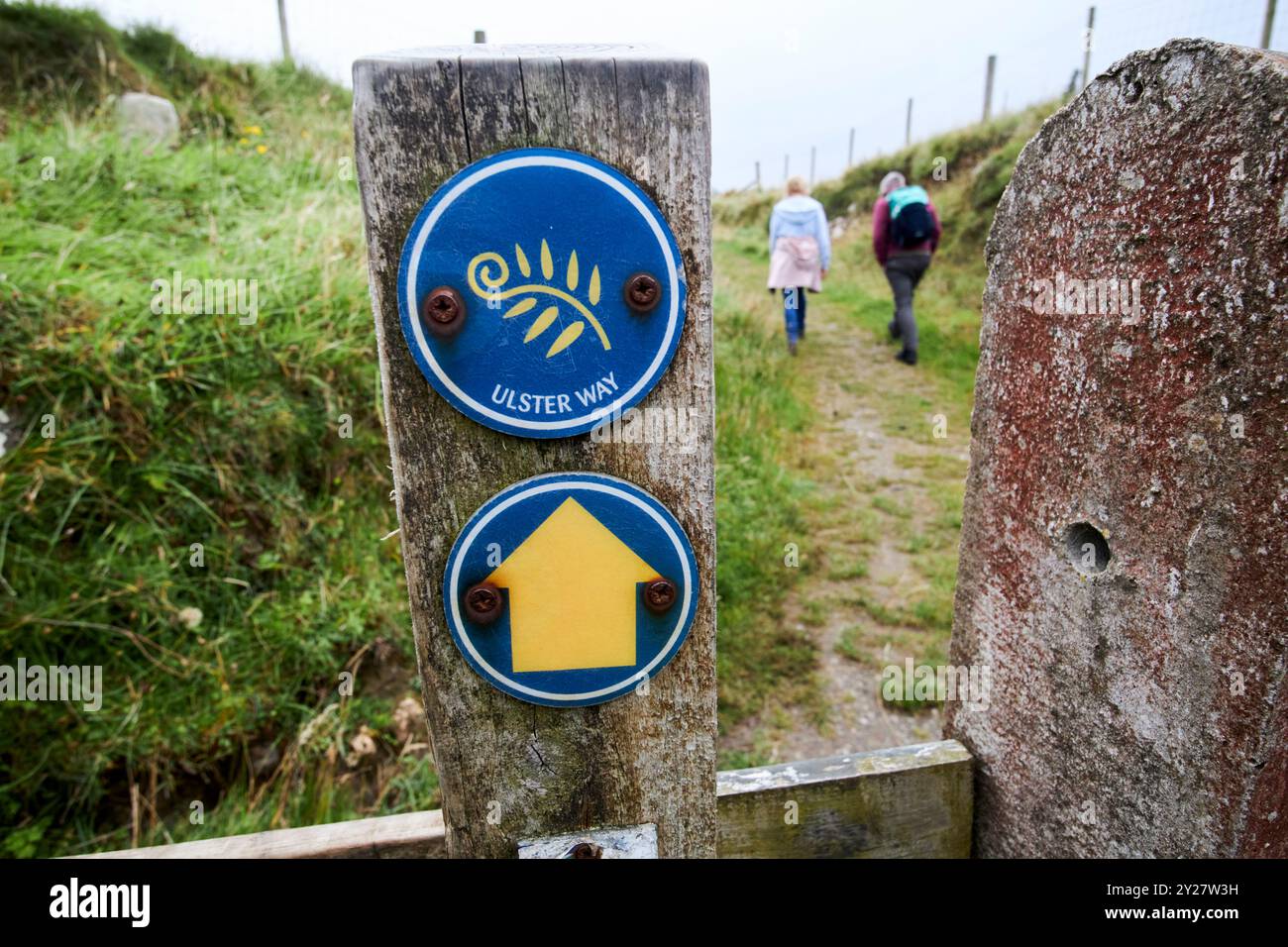 walkers on the public pathway along the ulster way north antrim north ...