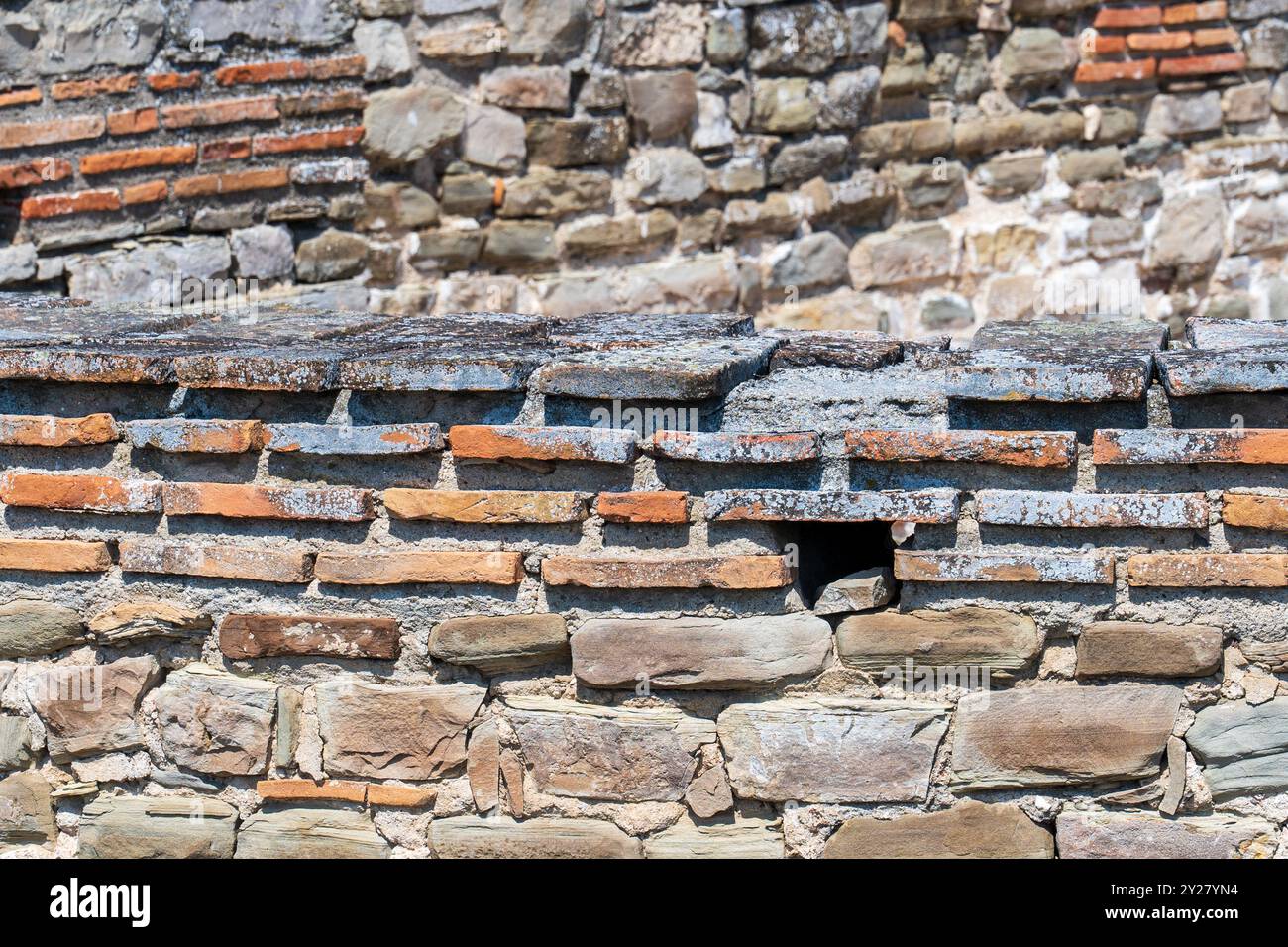 Colorful Stone and Brick Wall Background: Ancient Macedonian City of ...