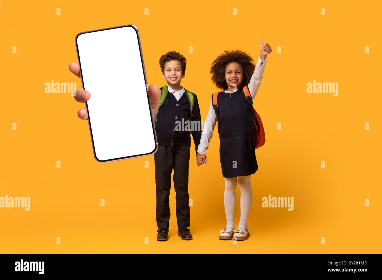 Happy kids holding hands hi-res stock photography and images - Alamy