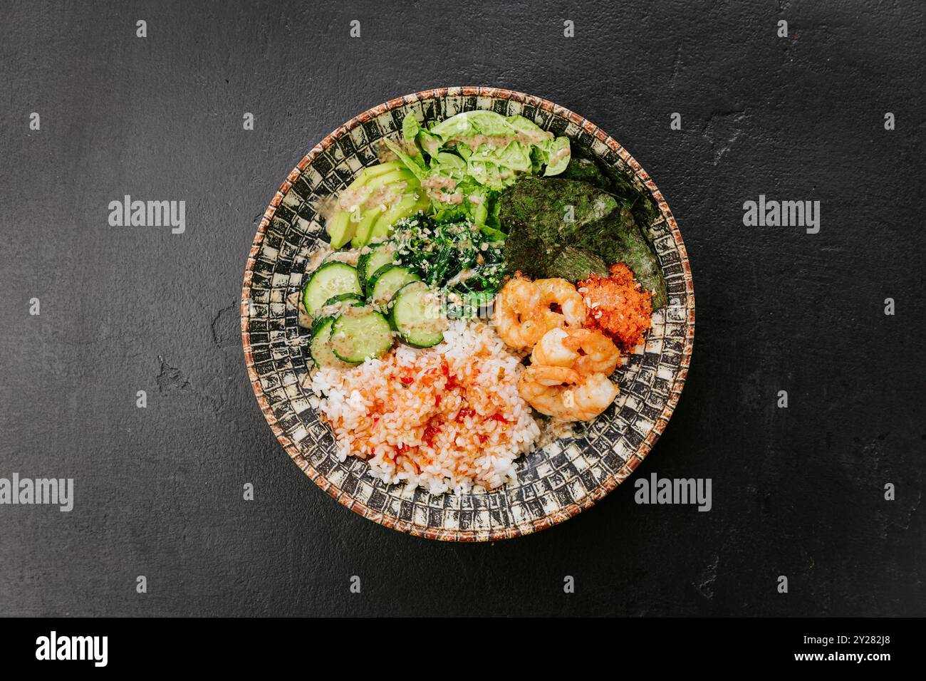Shrimp poke bowl with rice, seaweed, avocado, and cucumber - fresh and ...