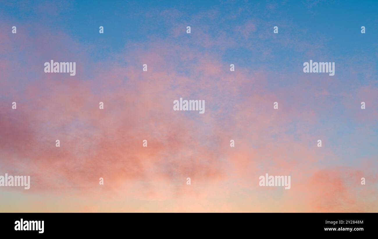 A sky with warm tones of yellow and orange, perfect for creating a ...