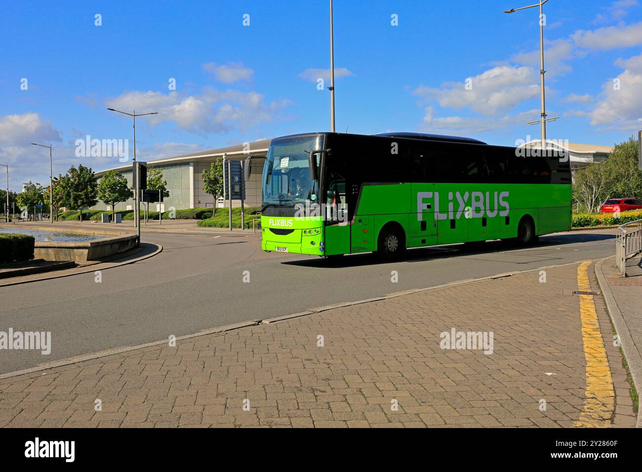 Green single-decker Flixbus, Cardiff Bay, South Wales, UK. Taken ...