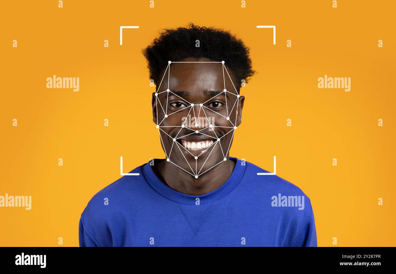 Smiling young man with facial recognition overlay on orange backdrop ...