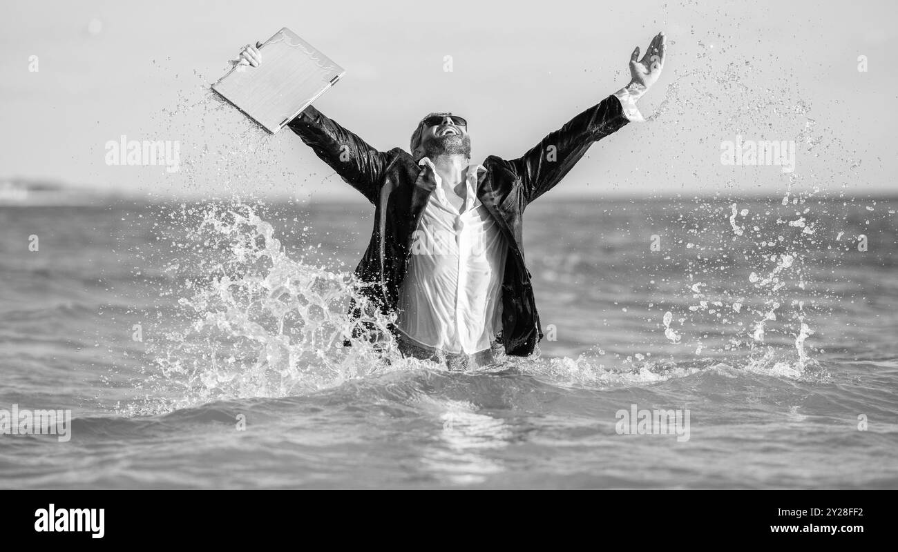 Business man in wet suit in sea water. Crazy business vacation ...